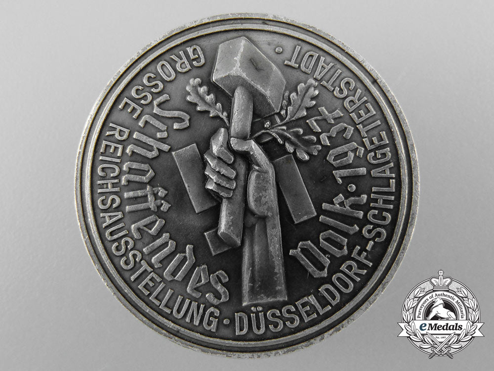 A 1937 Reich’s Exhibition Of A Productive People Badge – eMedals